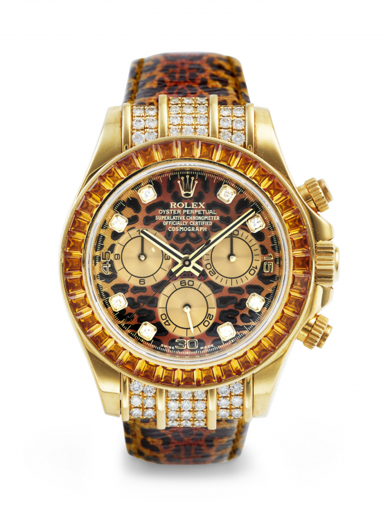ROLEX. A RARE AND EXUBERANT 18K GOLD, DIAMOND, AND YELLOW SAPPHIRE-SET AUTOMATIC CHRONOGRAPH ...