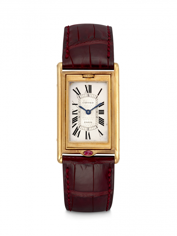CARTIER. A RARE 18K GOLD LIMITED EDITION RECTANGULAR REVERSIBLE ...