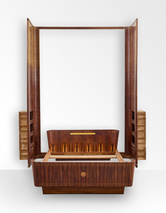 Double bed integrated into a monumental equipped wall