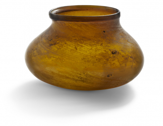 A MEROVINGIAN AMBER GLASS BAG BEAKER