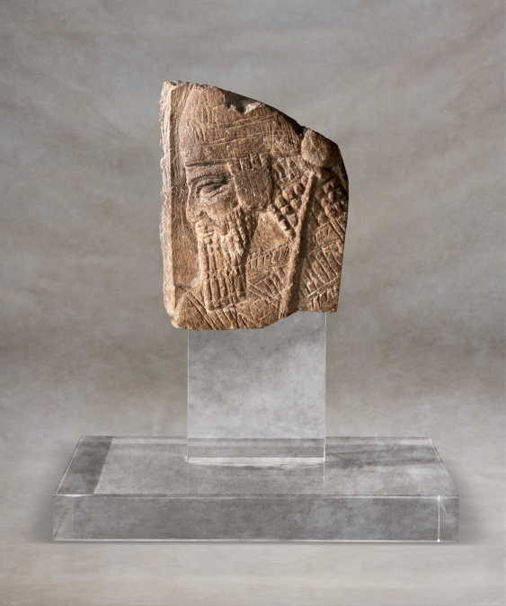 AN ASSYRIAN GYPSUM RELIEF FRAGMENT