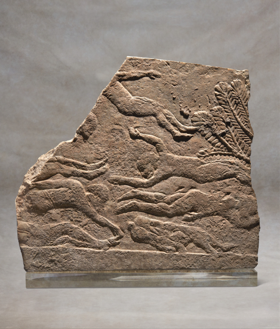 AN ASSYRIAN GYPSUM RELIEF FRAGMENT